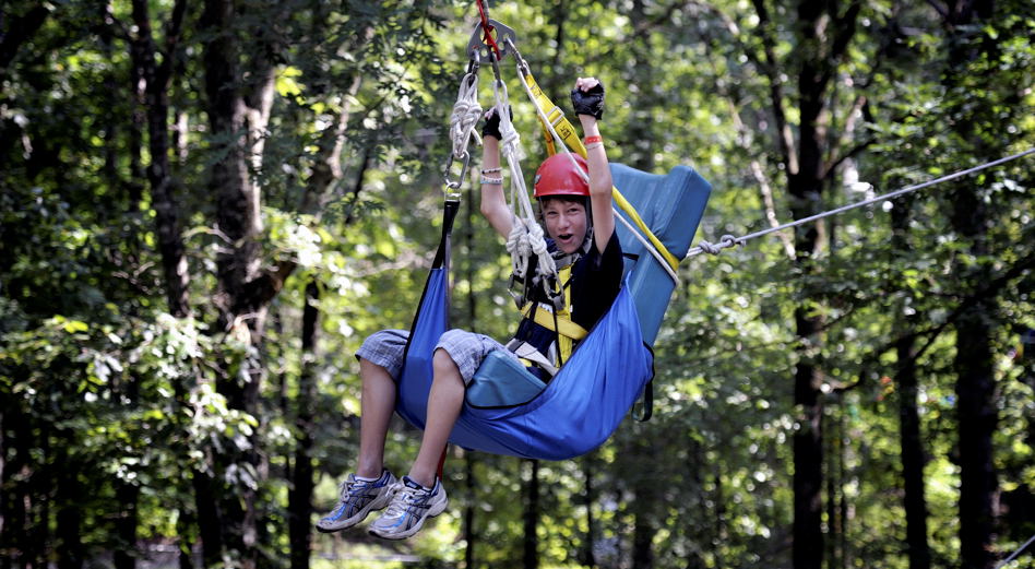 Global Lens » Archive » Braxton Carney rides a zip line at Camp Aldersgate